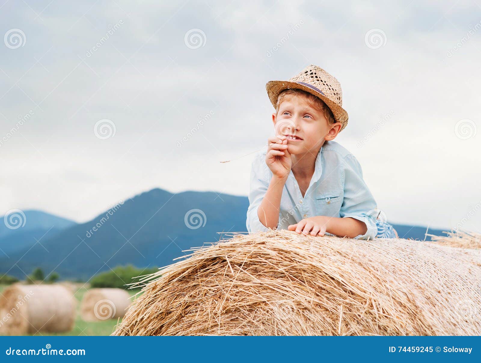 Dreaming Boy Lying on the Rolling Haystack Stock Image - Image of ...