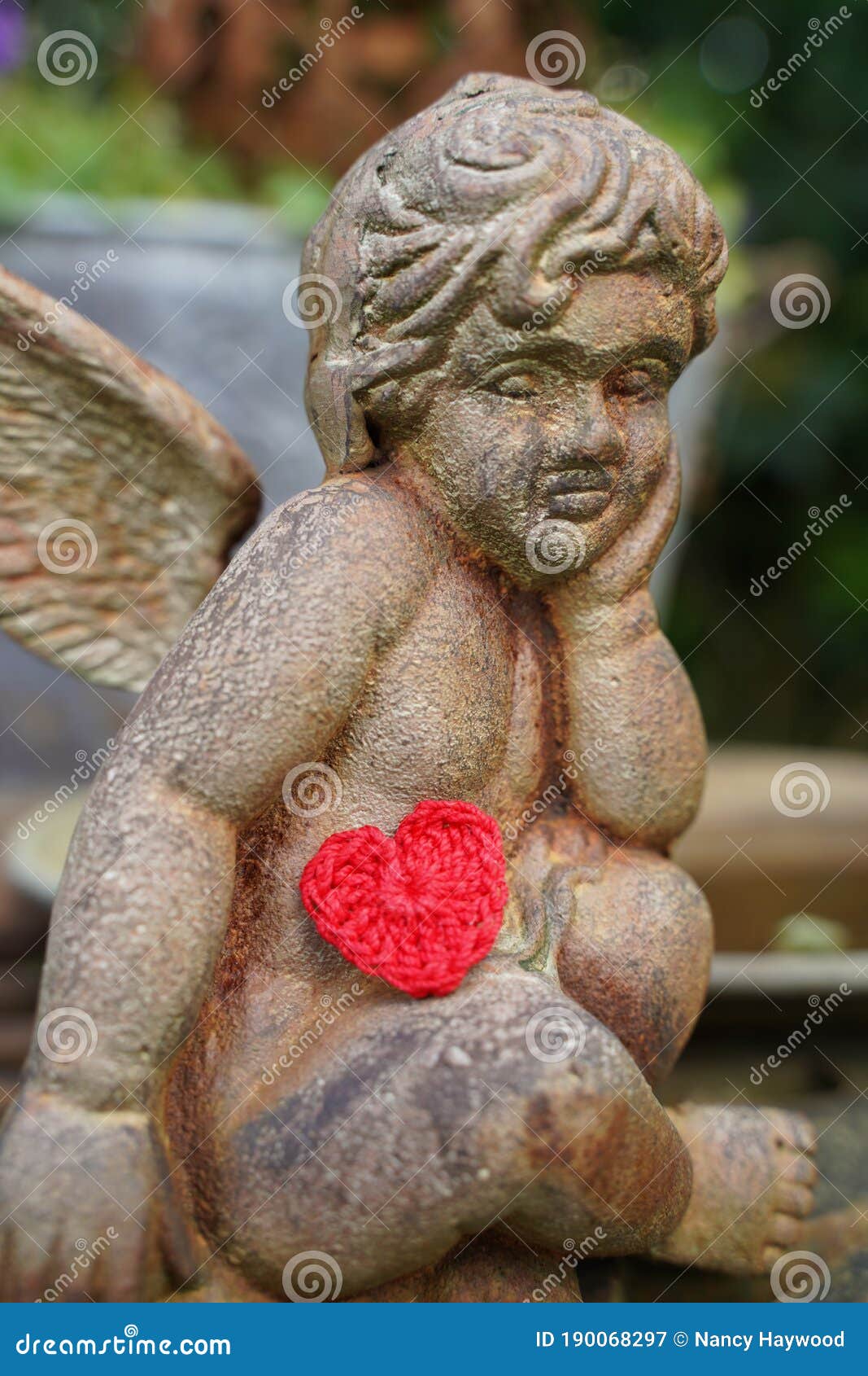 Dreamy Angel Statue with a Crocheted Red Heart. Stock Image - Image of ...