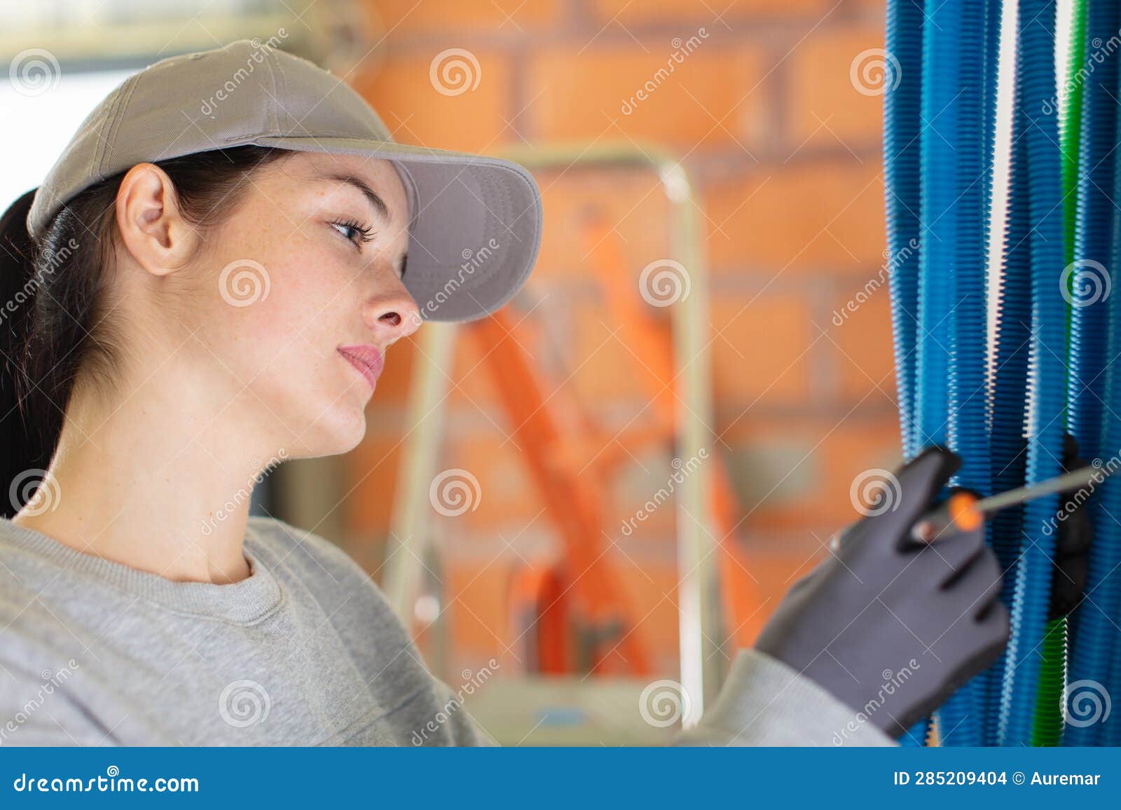 Dreamy Female Electrician Looking at Bundle Cable Conduit Stock Photo ...