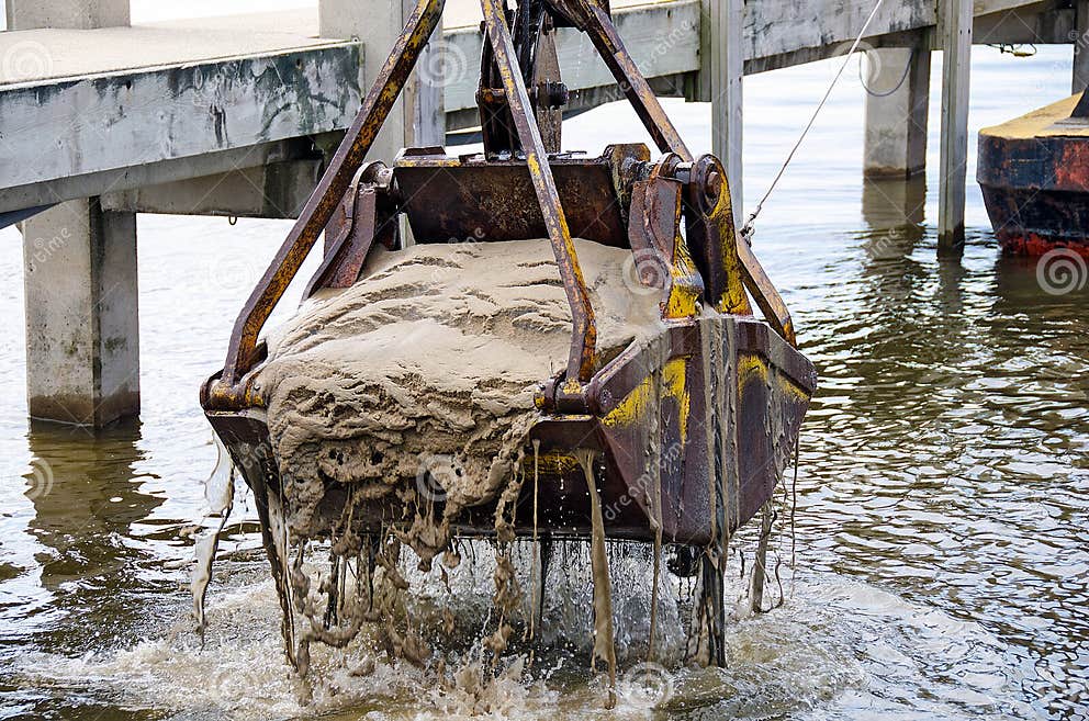 Dredging Bucket in Lake Marina Stock Photo - Image of sandy, machinery ...