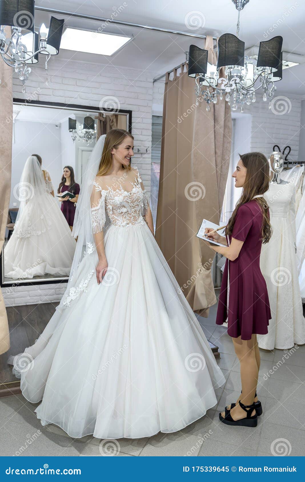 Dressmaker with Notepad in Wedding Salon and Bride Stock Image - Image ...