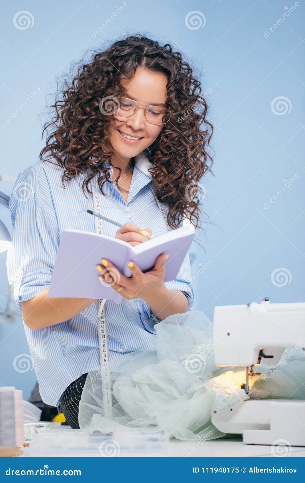 Dressmaker Sitting on the Table and Counting Expenses on Making ...
