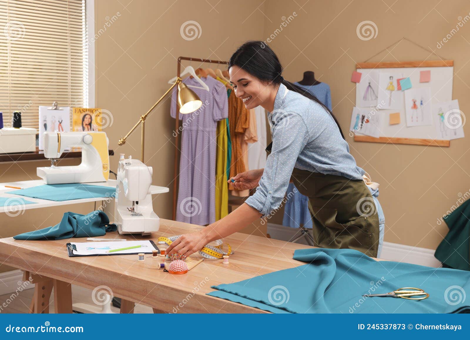 Dressmaker Working at Table in Modern Atelier Stock Image - Image of ...