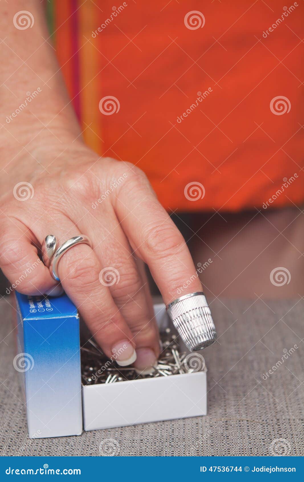Dressmakers Hands Thimble Finger Reaching into Box of Pins Stock Photo ...