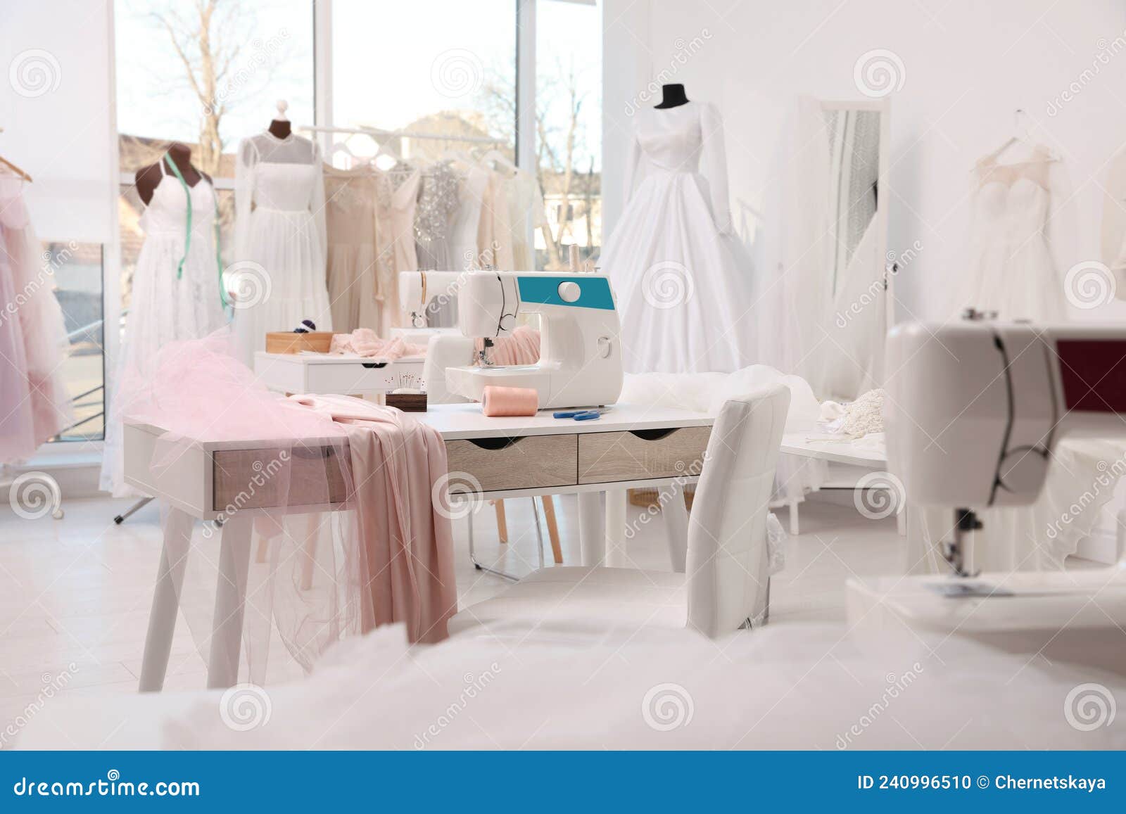 Dressmaking Workshop Interior with Wedding Dresses and Equipment Stock ...