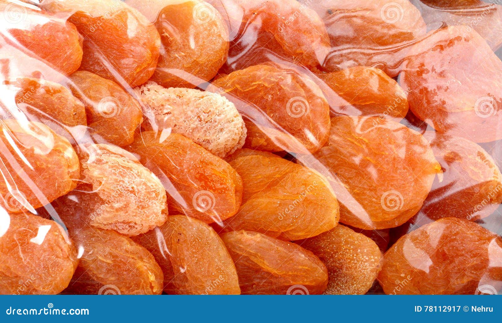 Dried Apricots on Plastic Packaging Stock Image - Image of orange ...