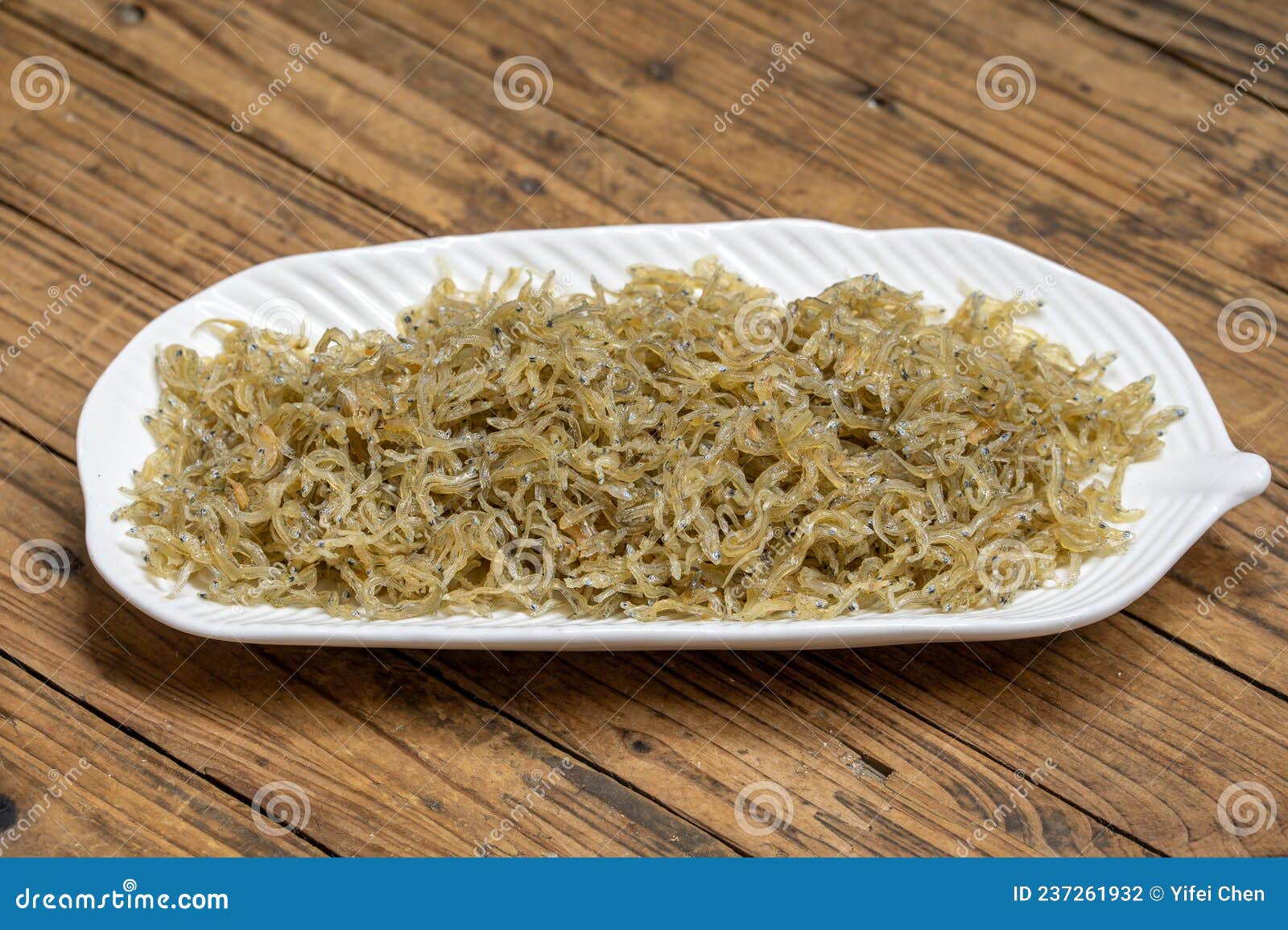 The Dried Clove Fish in the Container is on the Wood Grain Table Stock ...