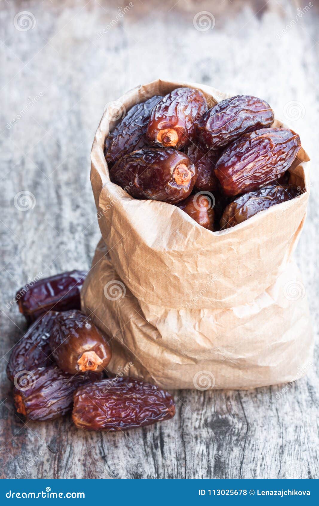Dried Dates in Paper Bag on Wooden Table Stock Photo - Image of dates ...