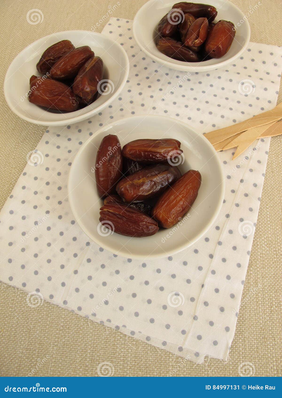 Dried dates in small bowls stock image. Image of flavor - 84997131