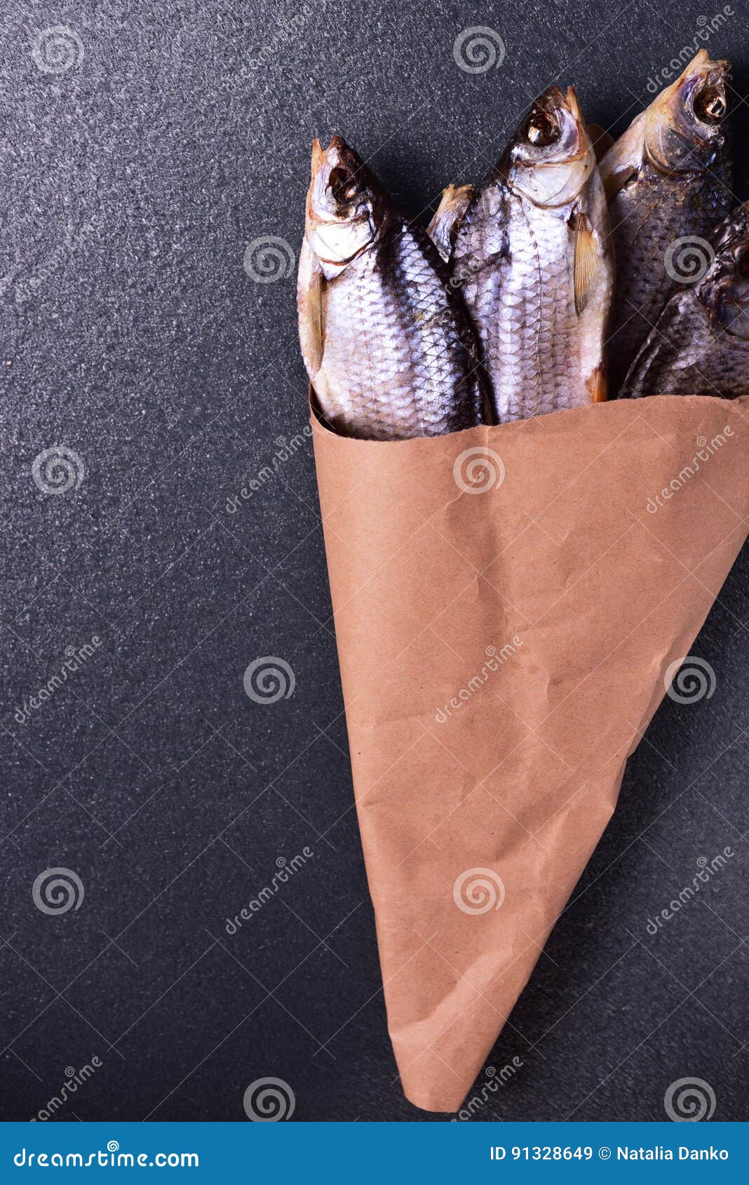 Dried Fish in a Bag with Paper on a Black Surface Stock Image - Image ...