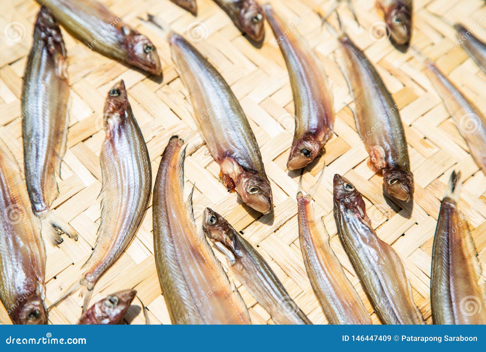 Dried Fish Drying in the Sun on Bamboo Board, Thai Food Stock Image ...