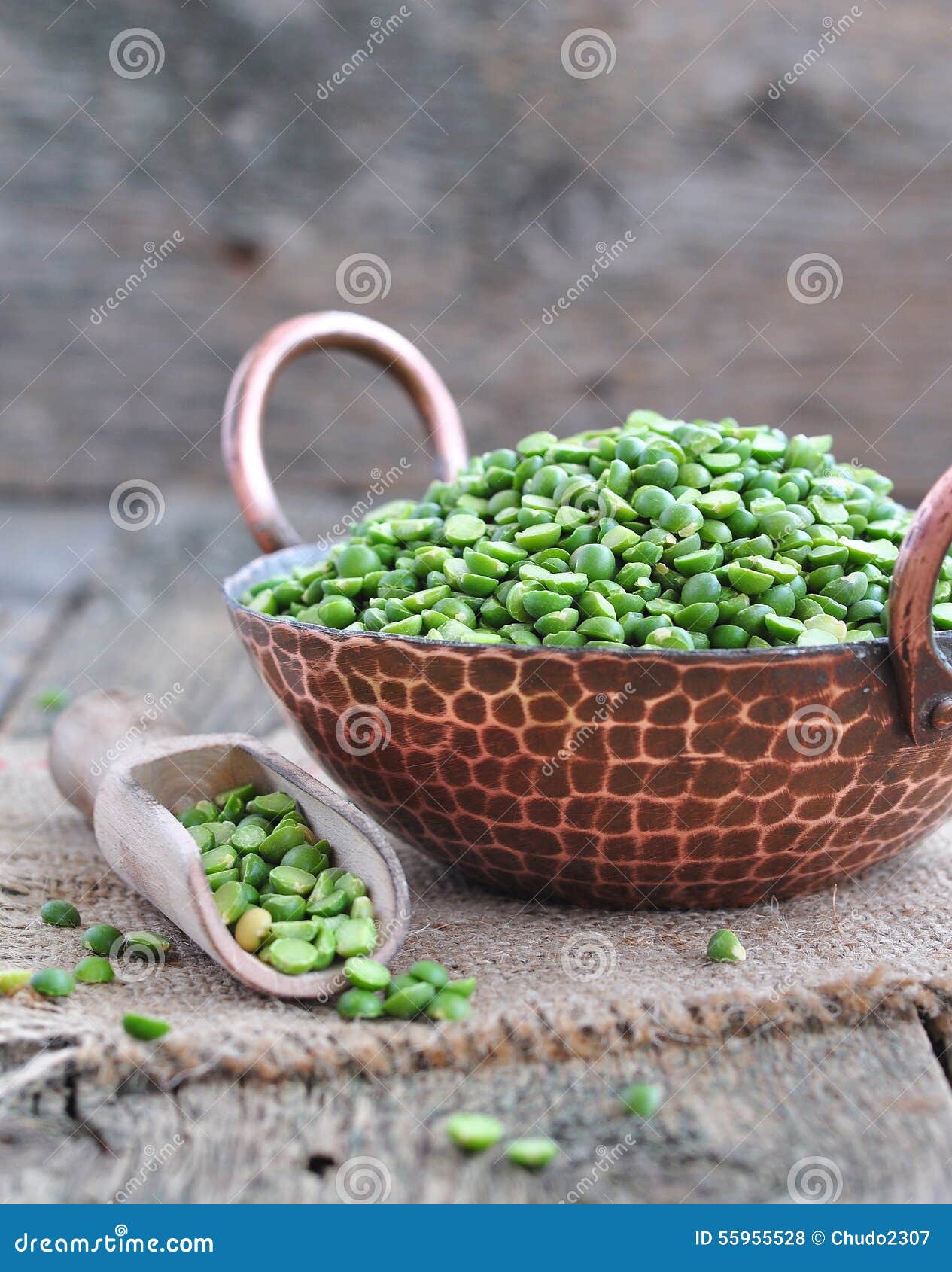 Dried Green Split Peas in a Copper Plate on a Wooden Table Stock Photo ...