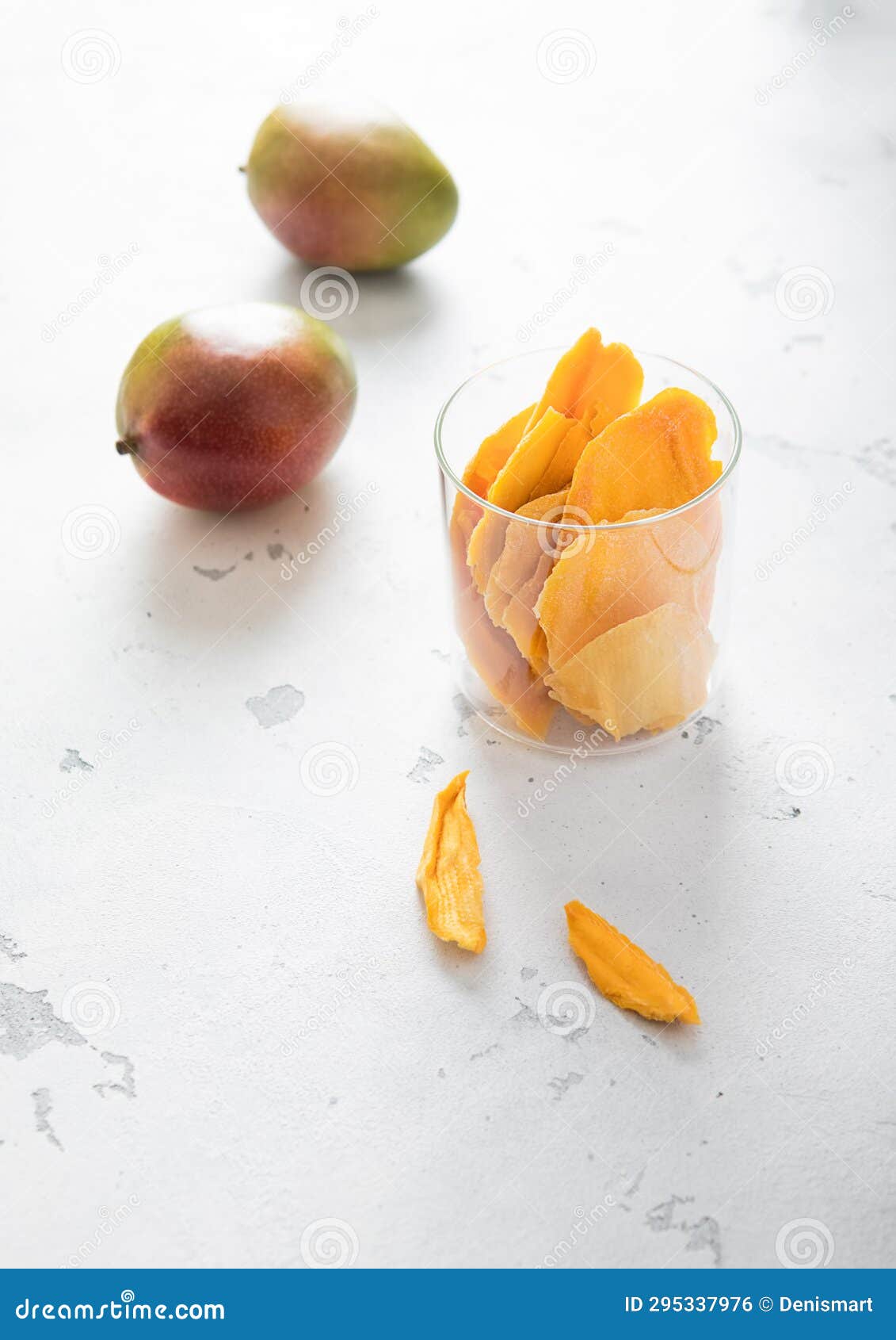 Dried Mango Slices with Two Fresh Raw Mangoes Stock Photo - Image of ...