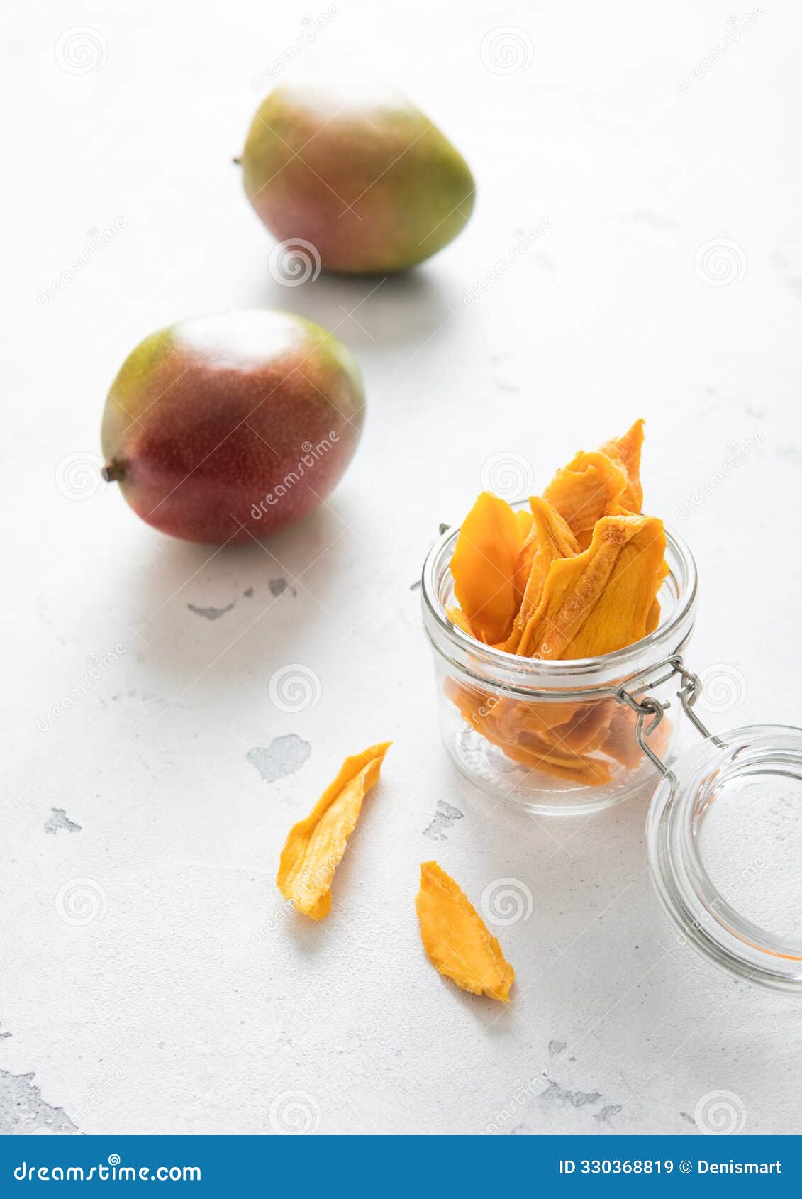 Dried Mango Slices with Two Fresh Raw Mangoes.Top View Stock Image ...
