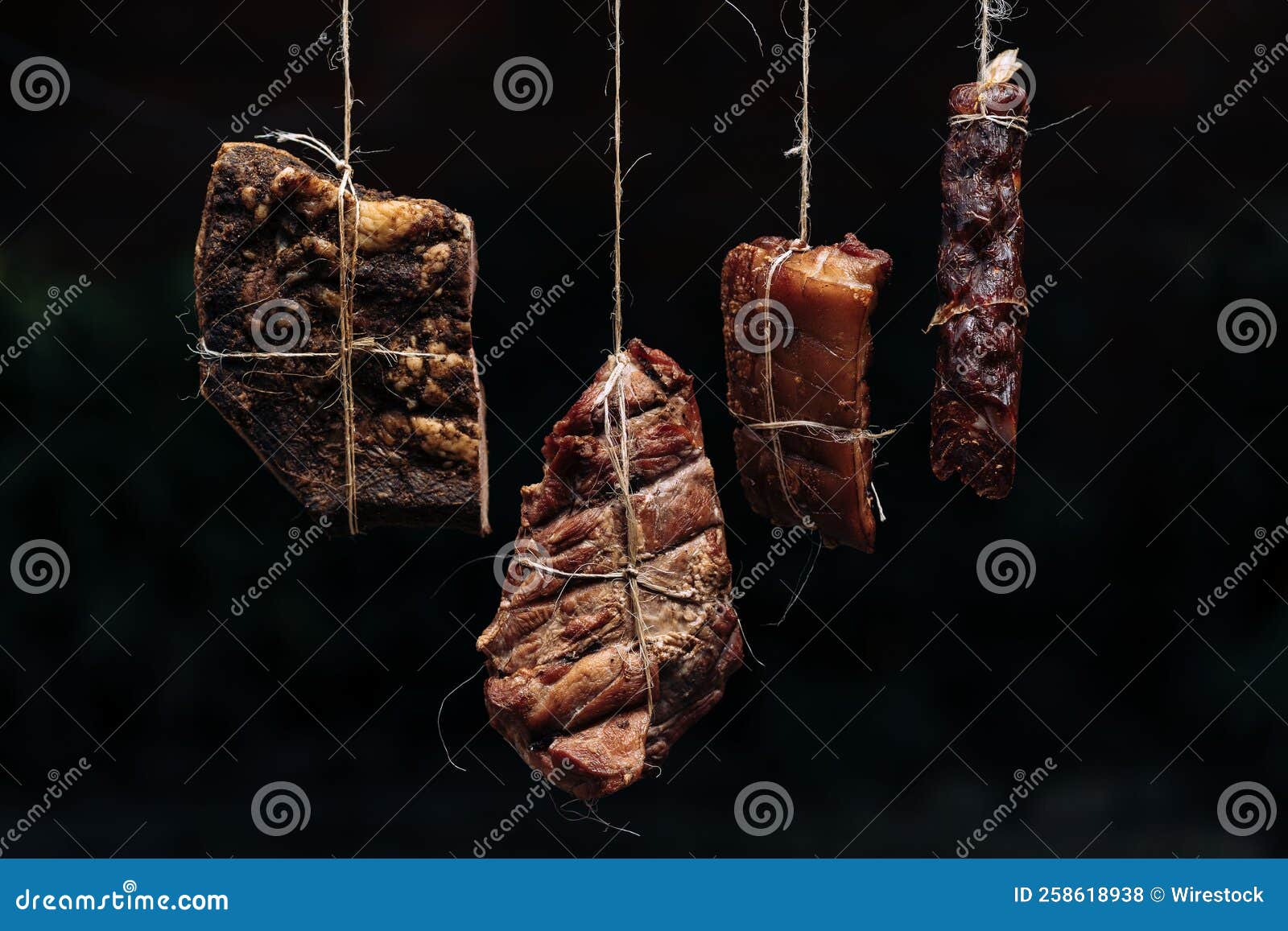 Dried Meat Hanging by a Thread on a Black Background Stock Photo ...