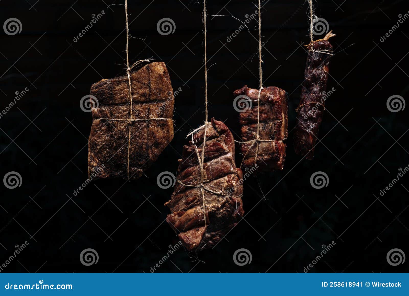 Dried Meat Hanging by a Thread on a Black Background Stock Image ...