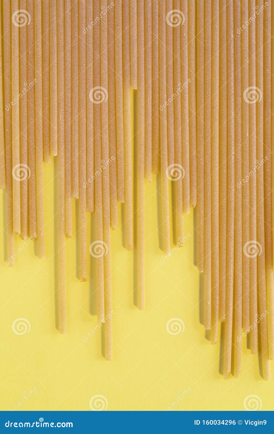Raw Spaghetti on Yellow Background Stock Photo - Image of macro, bright ...