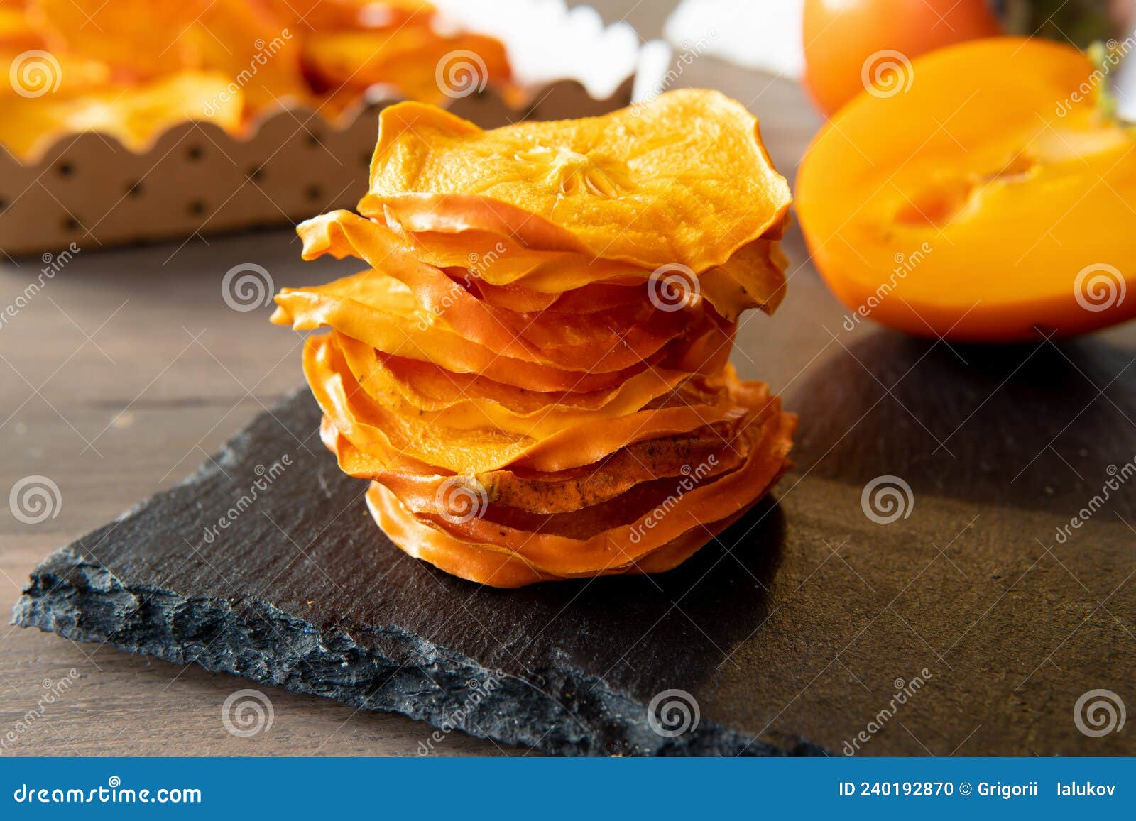 Dried Persimmon on a Wooden Kitchen Table. Stock Photo - Image of ...