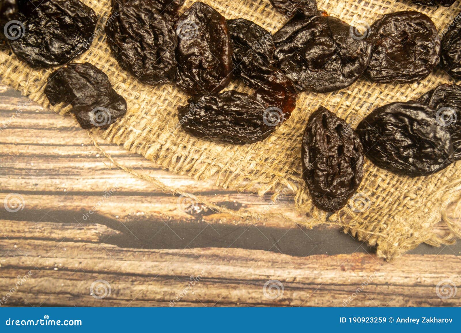 Dried Prunes in Bulk on Burlap with a Rough Texture. Close Up Stock ... Dried Prunes in Bulk on Burlap with a Rough Texture. Close Up Stock ...