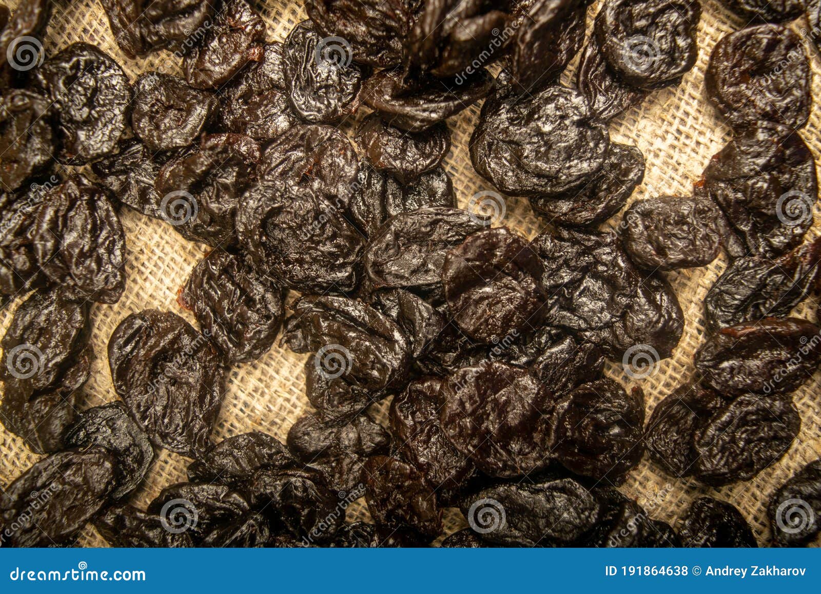 Dried Prunes in Bulk on Burlap with a Rough Texture. Close Up Stock ... Dried Prunes in Bulk on Burlap with a Rough Texture. Close Up Stock ...