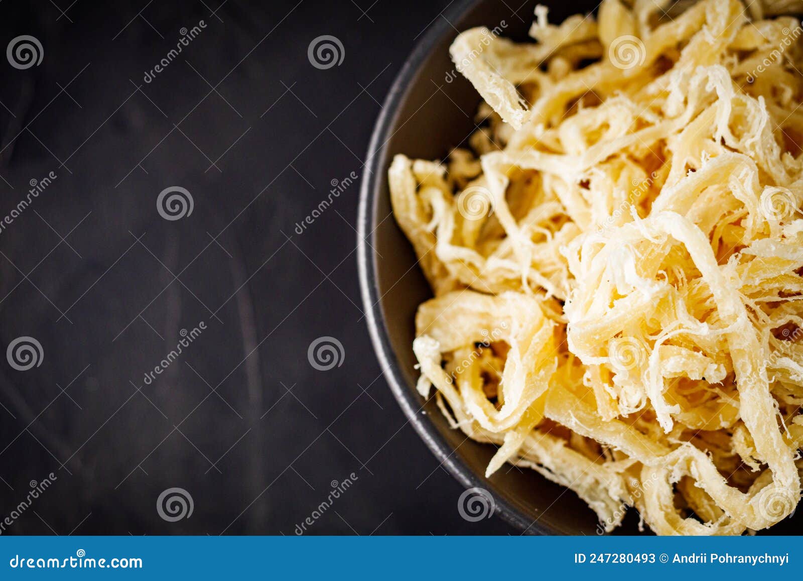 Dried Squid Meat on a Dark Stone Background Stock Image - Image of ...