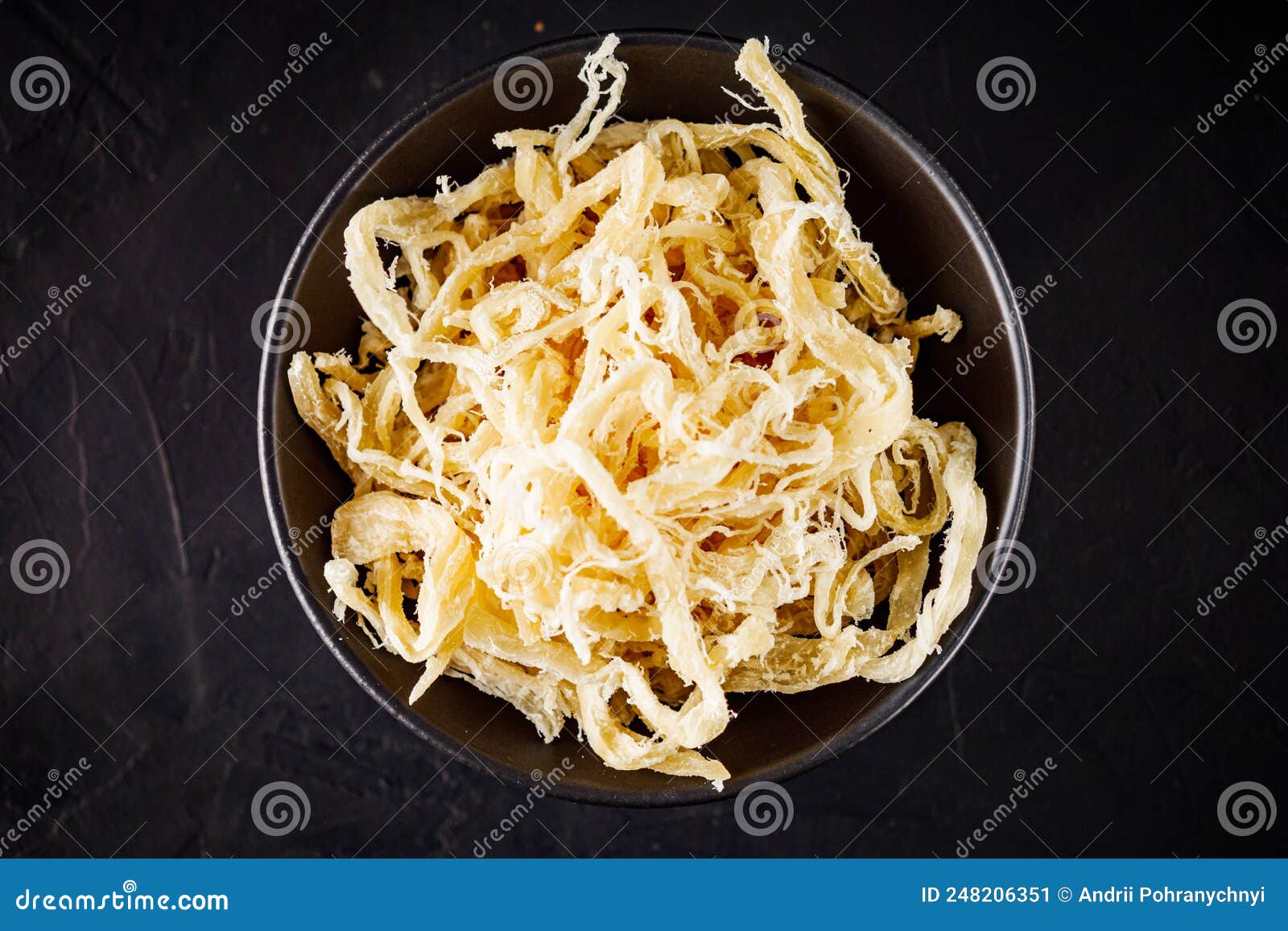 Dried Squid Meat on a Dark Stone Background Stock Image - Image of ...