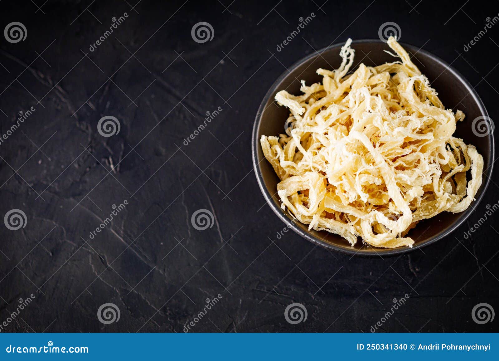 Dried Squid Meat on a Dark Stone Background Stock Photo - Image of ...
