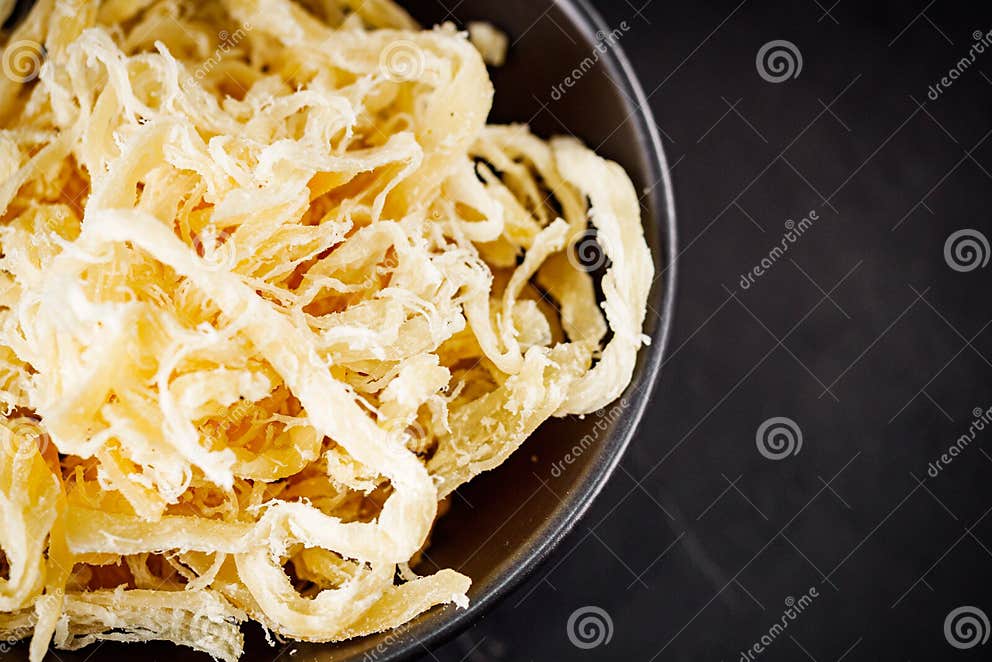 Dried Squid Meat on a Dark Stone Background Stock Photo - Image of dark ...