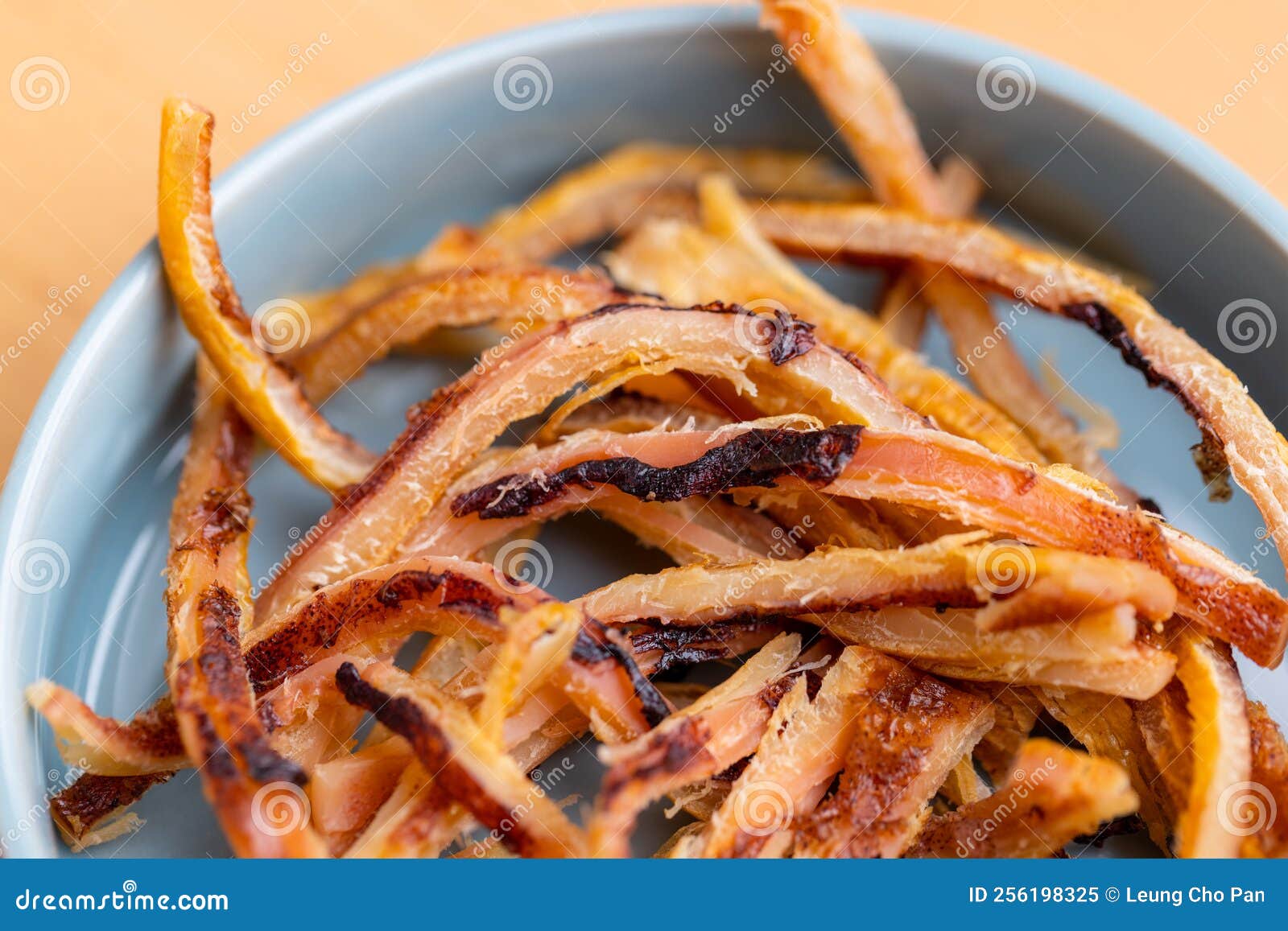 Dried squid snack in plate stock image. Image of culture - 256198325