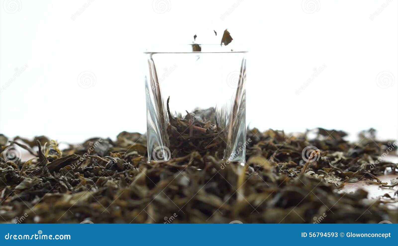 Dried Tea Leaf Filling in Clear Glass on White Background Stock Video ...