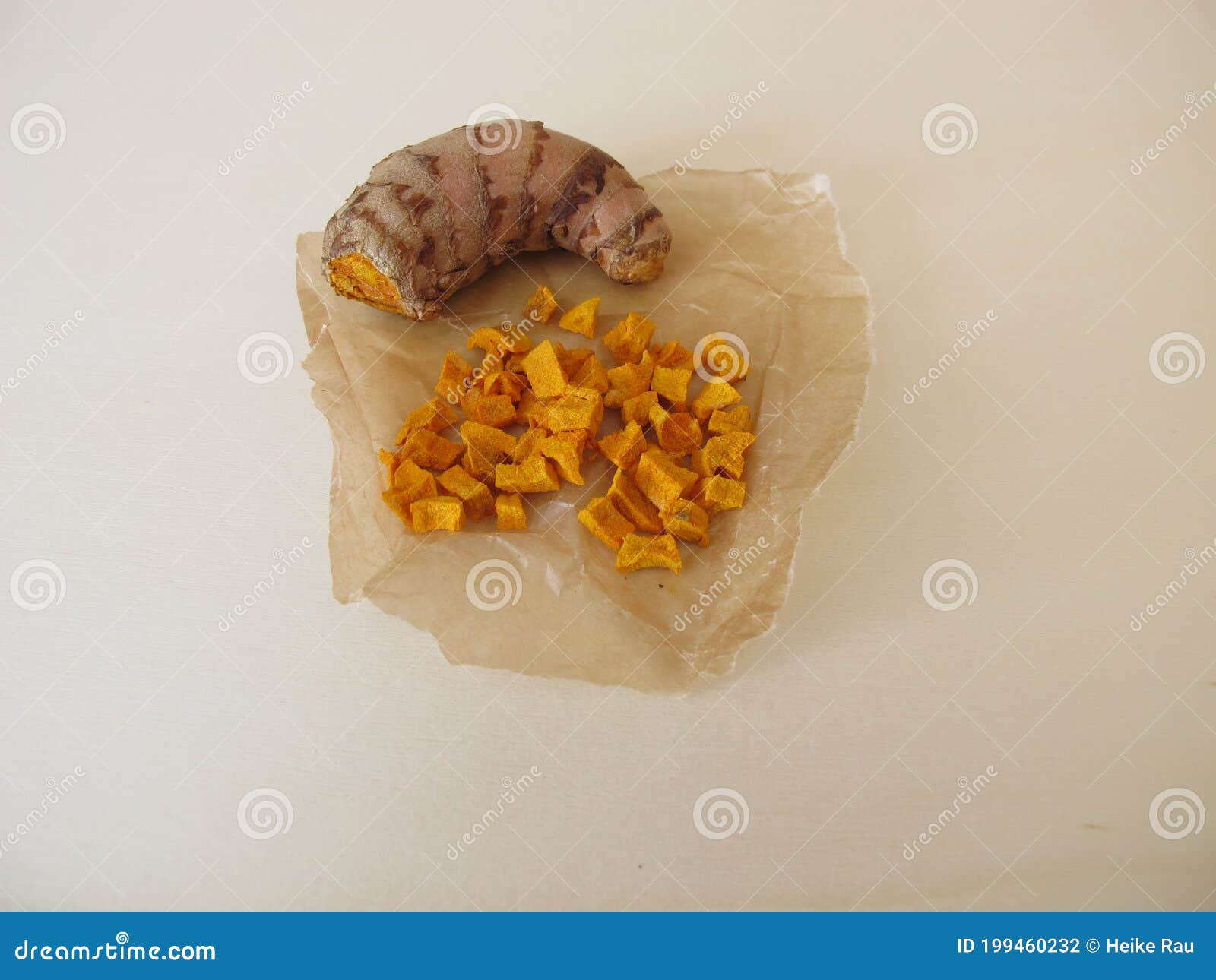 Dried Turmeric in Wax Paper Stock Photo - Image of rhizomes, golden ...
