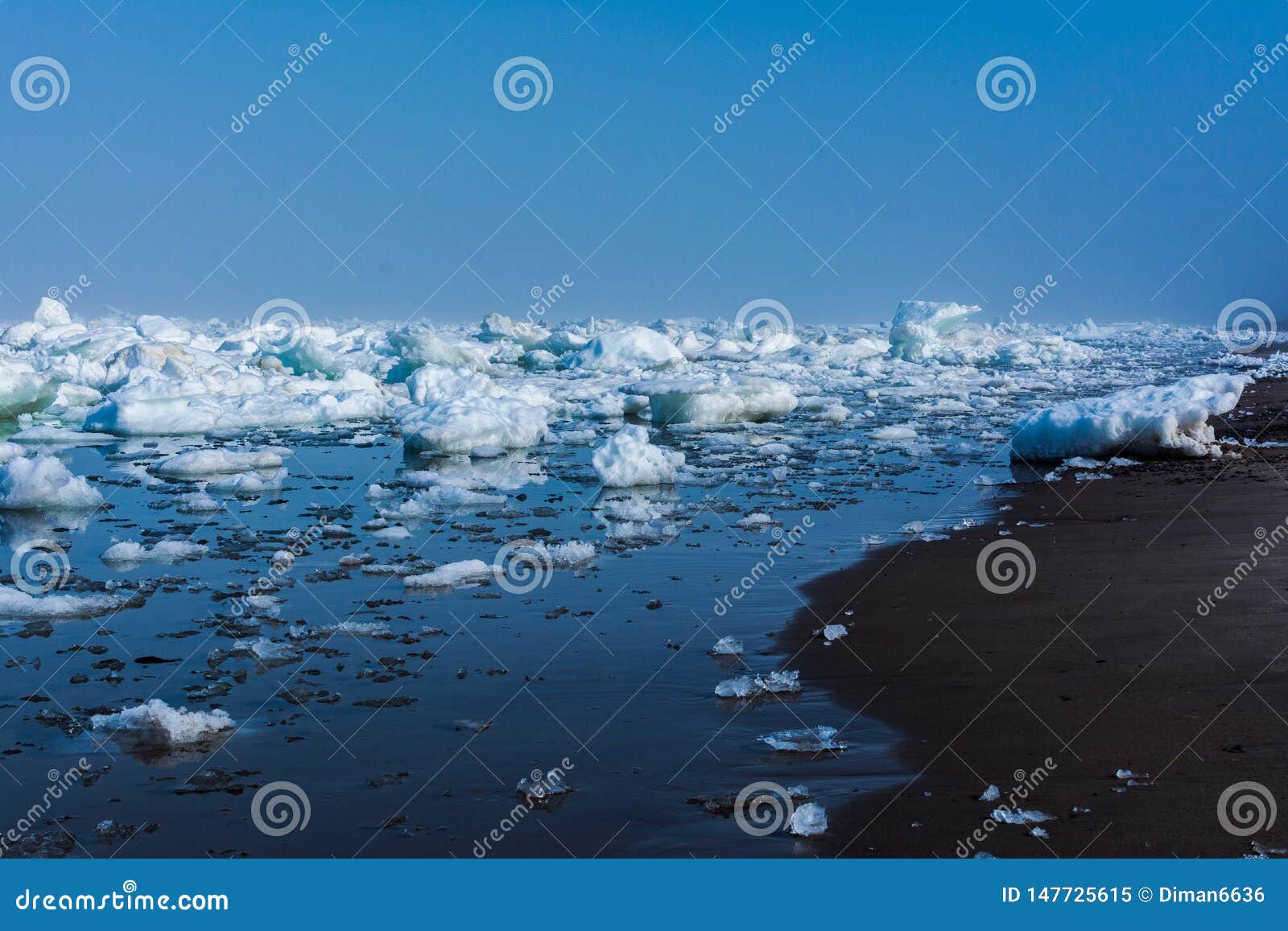 Drifting Ice in the Sea Near the Sandy Coast. Ice in the Sea Near the ...