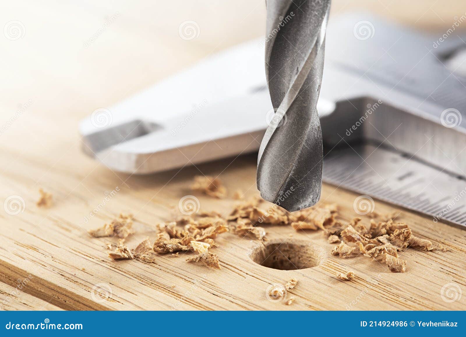 Drill Bit Making Hole in Wooden Oaks Plate, with Ruler and Caliper ...