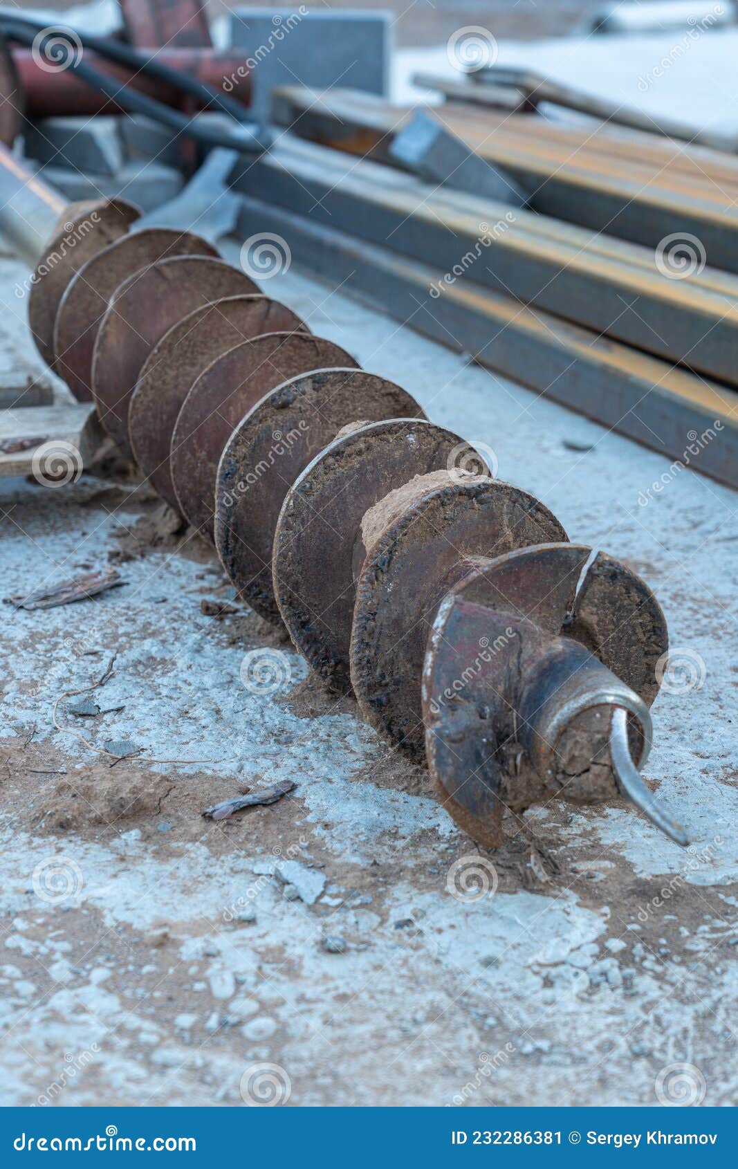 Drill Bit on a Tractor for Installing Piles on a Construction Site ...