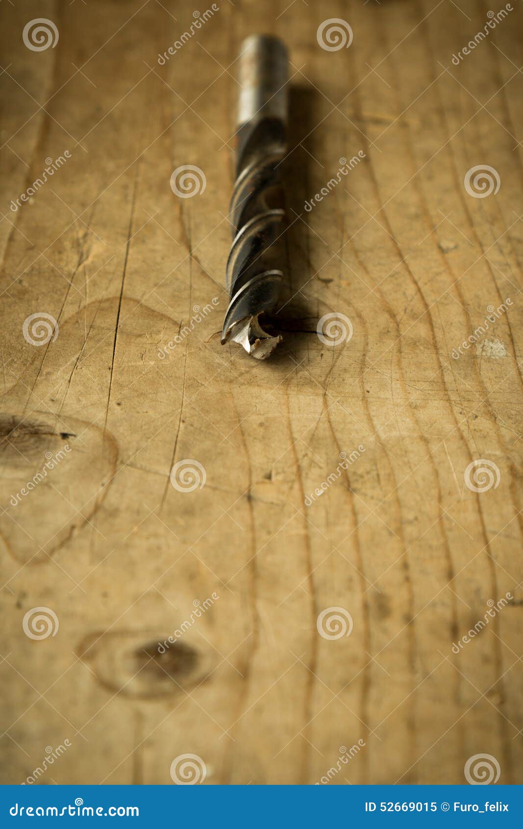 Drill bit on wooden table stock image. Image of wood - 52669015