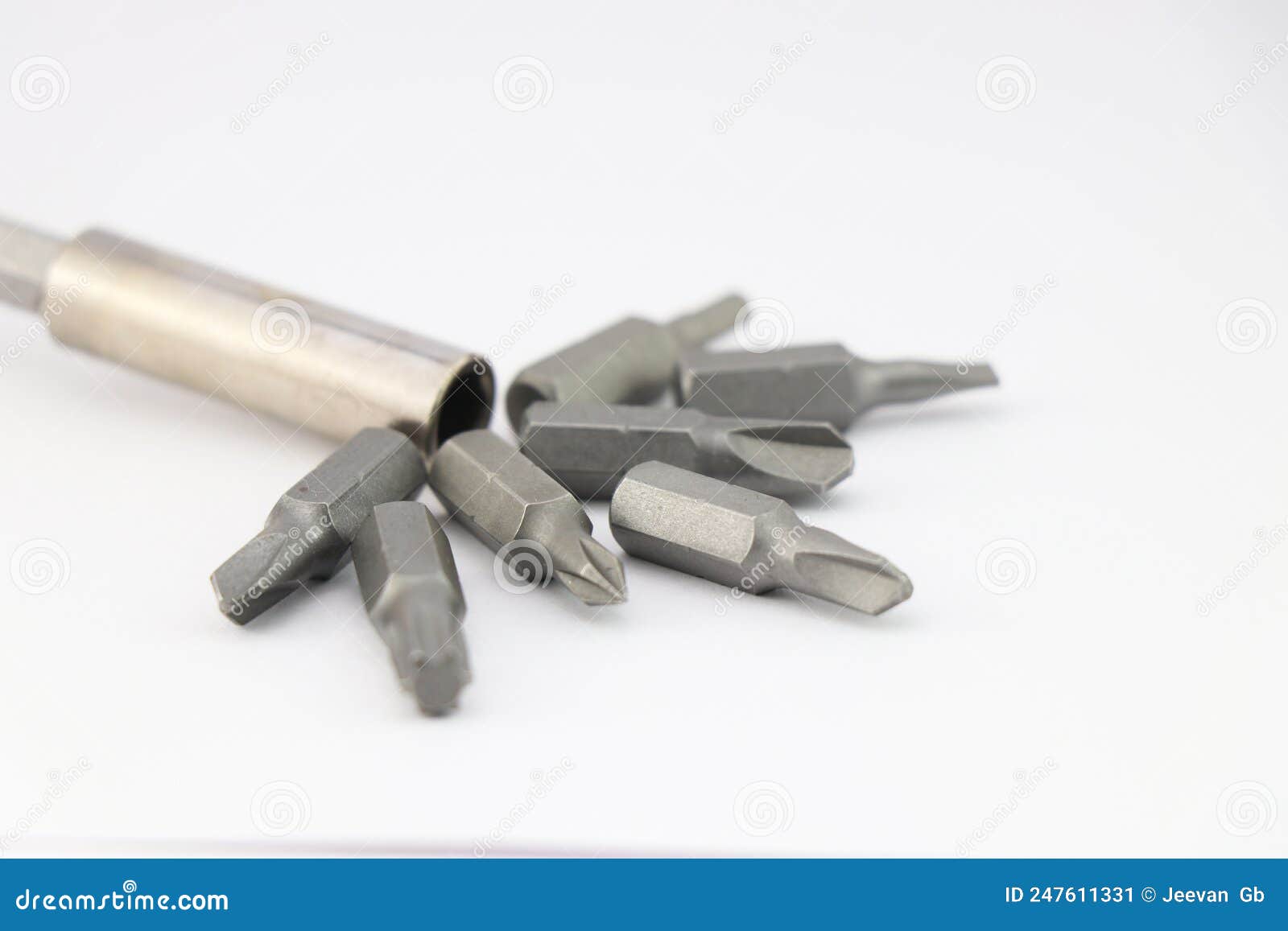 Drill Bits of Various Shapes Along with Screwdriver Head on White ...