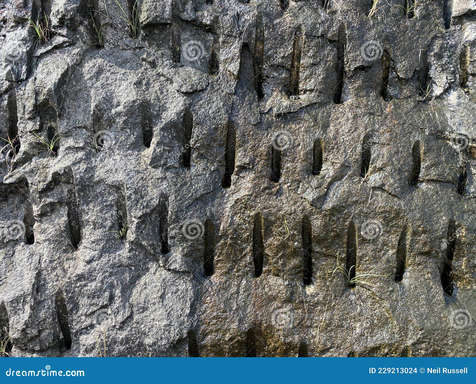 Drill Holes in Rock stock photo. Image of rockface, drill - 229213024