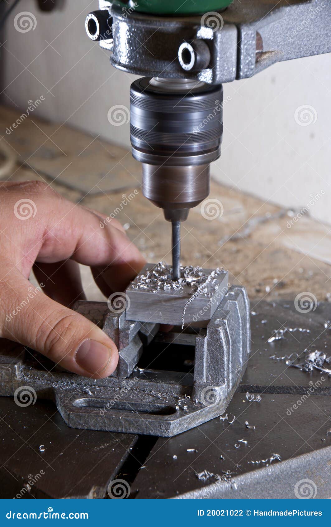 Drilling into a Block of Metal Stock Photo - Image of cuttings, metal ...