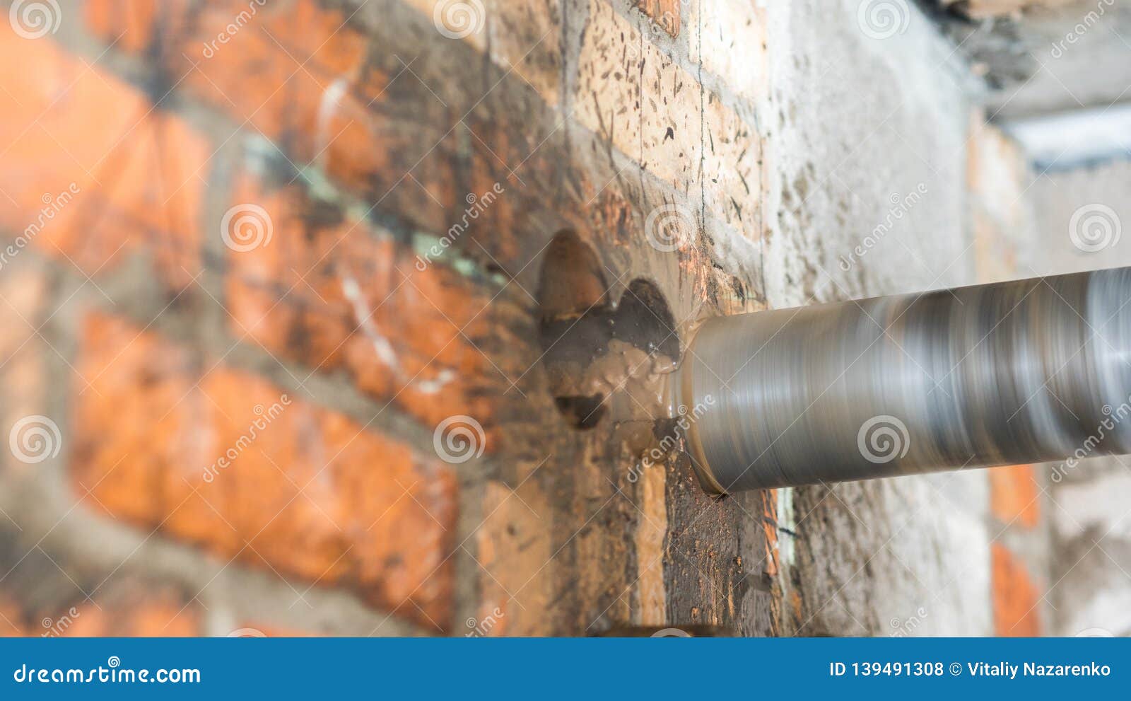 Drilling a Brick Wall with a Diamond Nozzle Stock Photo - Image of ...