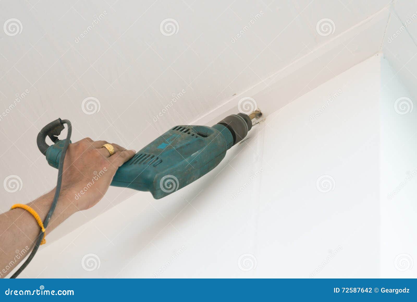 Drilling a Ceiling with Electric Drill Stock Photo - Image of body ...