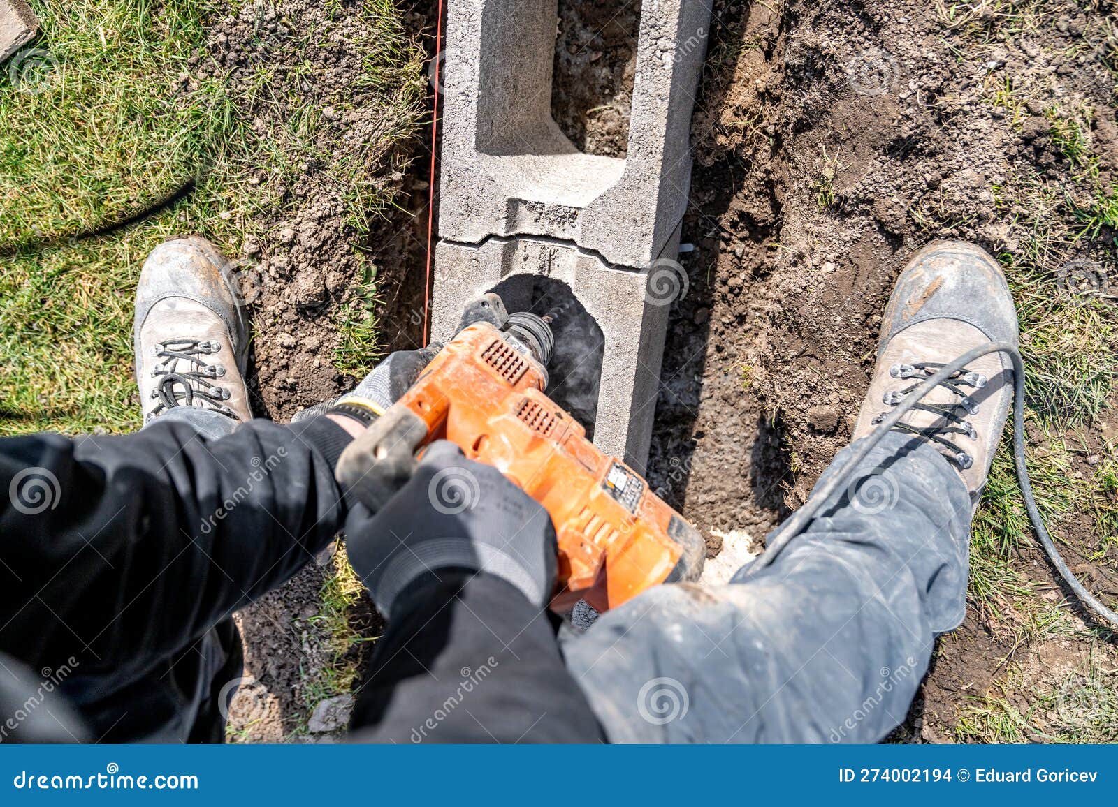 Drilling of Concrete Foundations with an Electric Drill Stock Photo ...