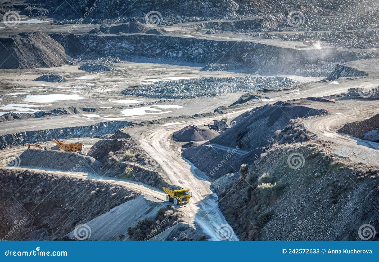Drilling and Crushing Machines and Mining Truck Working in Stone Quarry ...