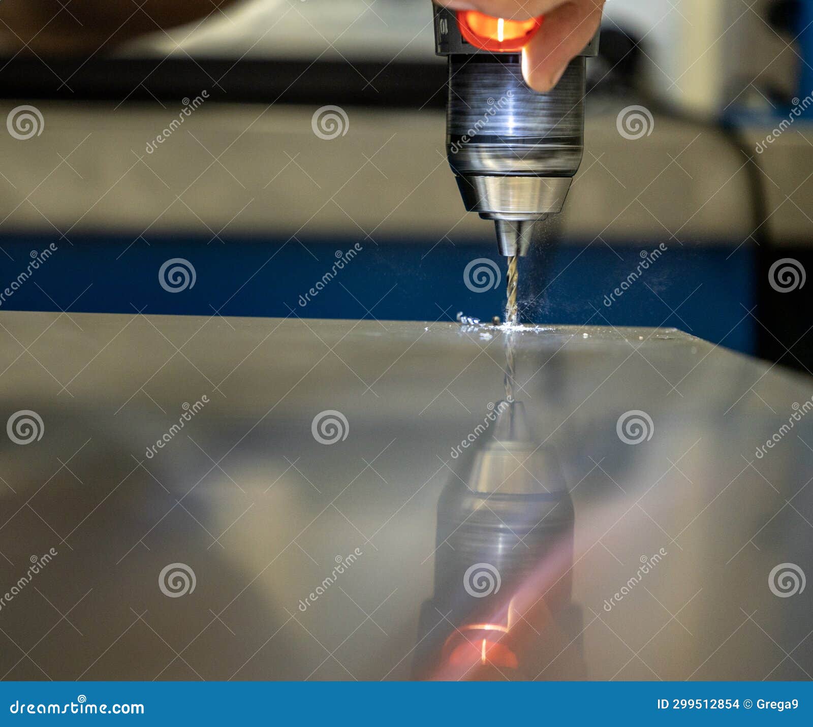 Drilling a Hole in the Metal Sheet Stock Photo - Image of closeup ...