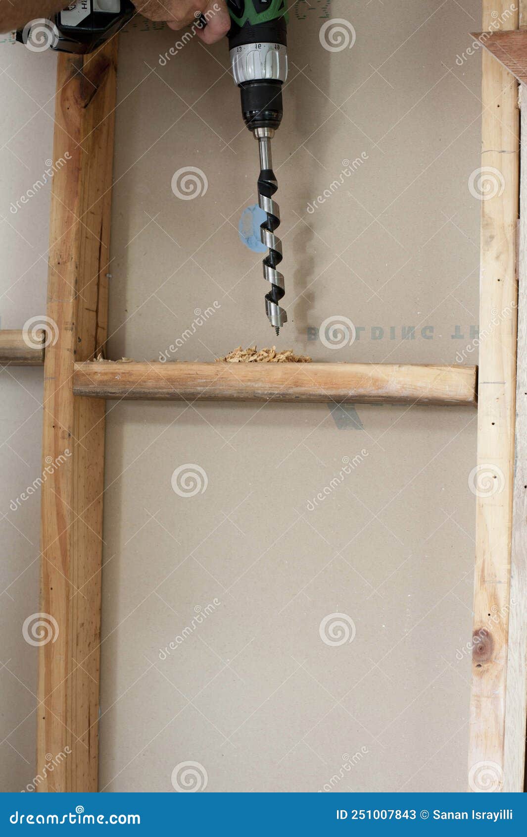 Drilling hole in stud wall stock image. Image of wooden - 251007843