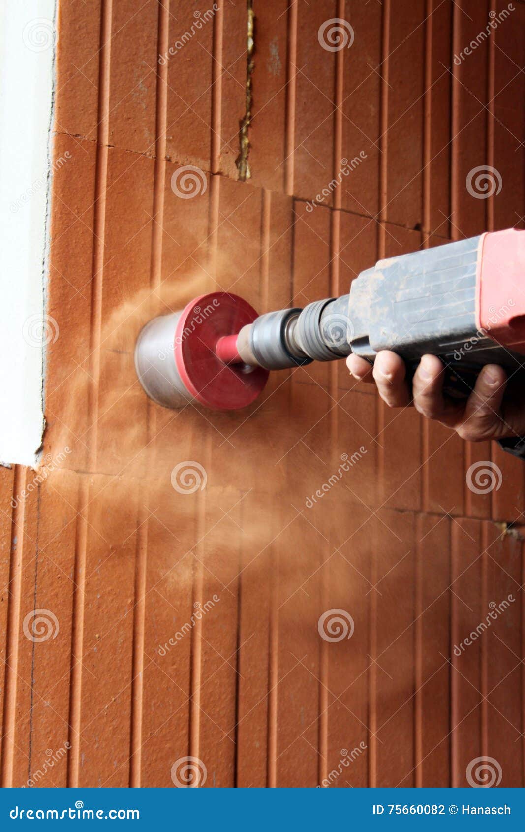 Drilling a Hole in the Wall, a Man at Work Stock Photo - Image of ...