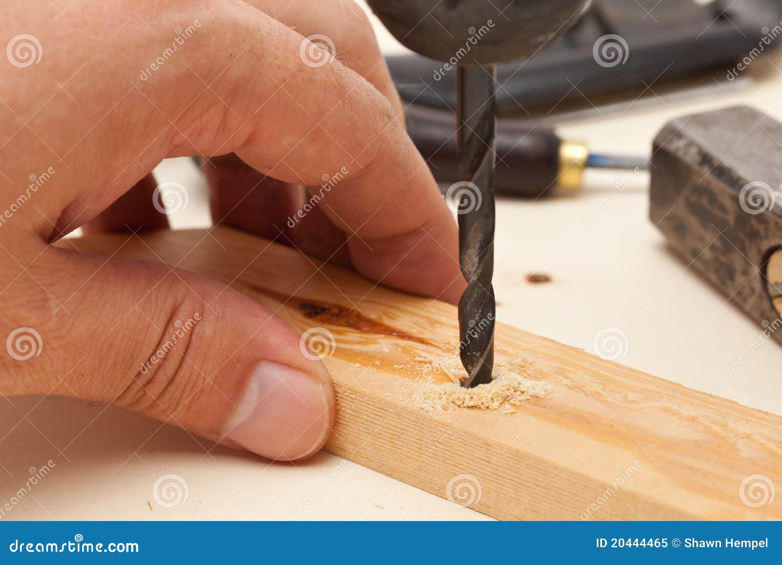 Drilling a hole into wood stock image. Image of bore - 20444465