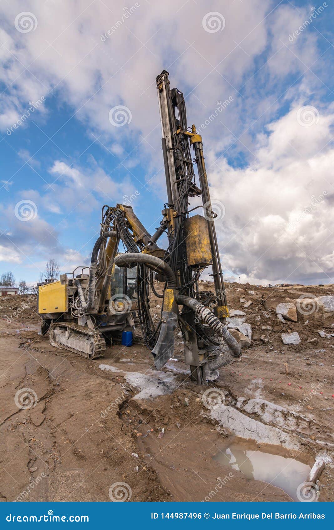 Drilling Machine in a Construction Site Surrounded by Rock and Mud ...