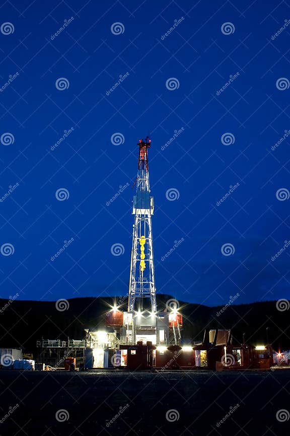 Drilling rig at night stock image. Image of compressor - 5921701