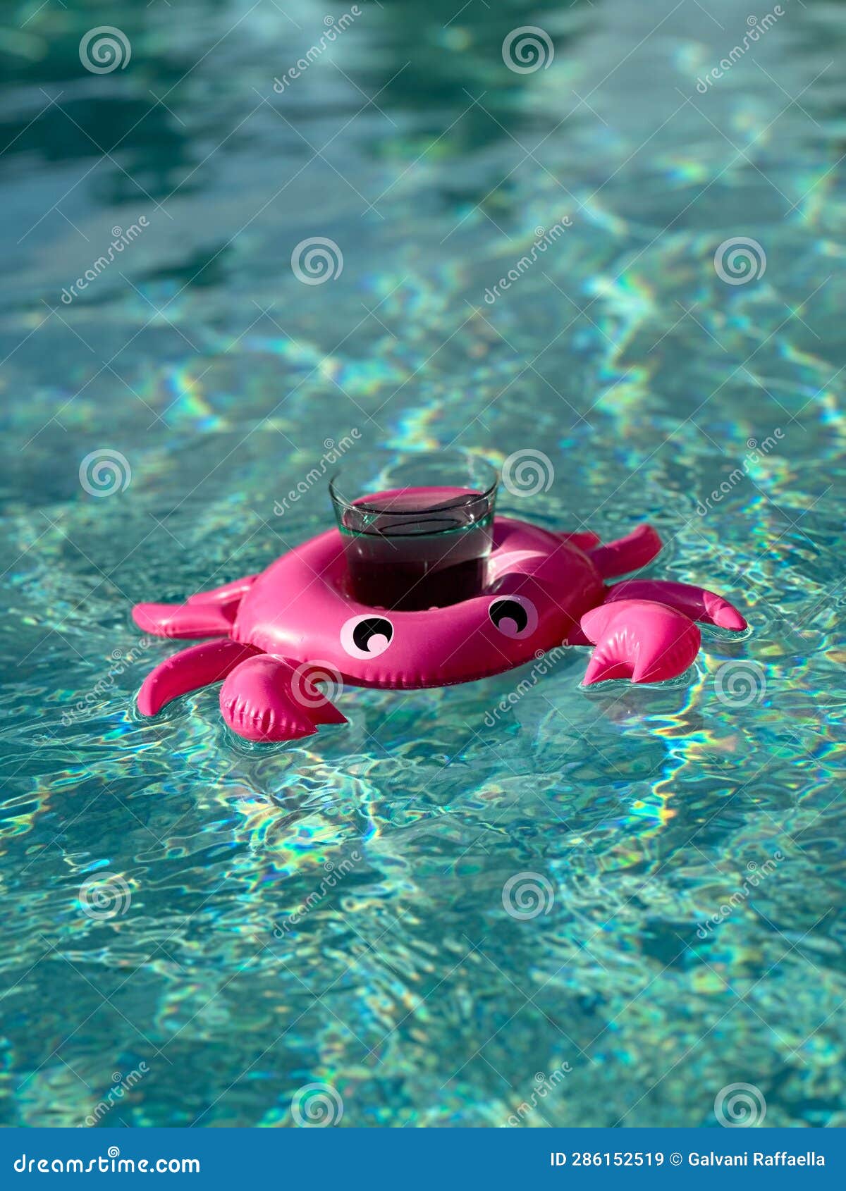 Drink Floating on a Pool in a Funny Inflatable in the Shape of Crab ...