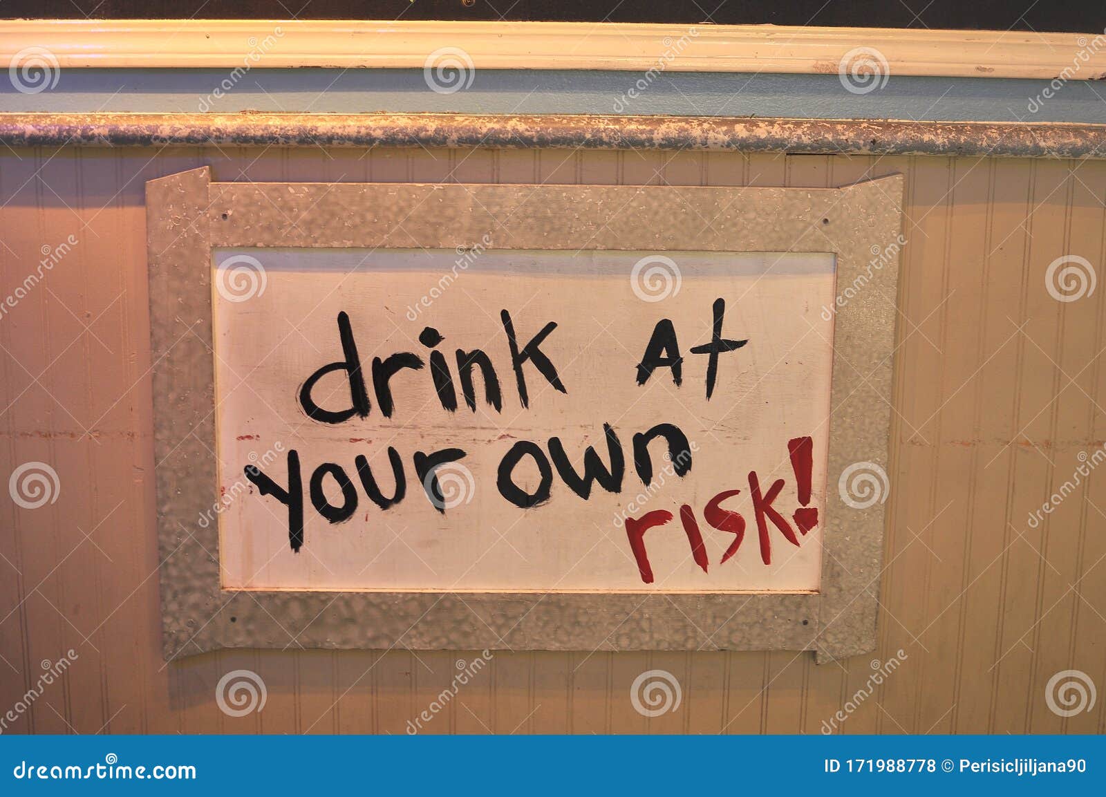 Drink at Your Own Risk Sign on the Wall. Stock Photo - Image of hand ...